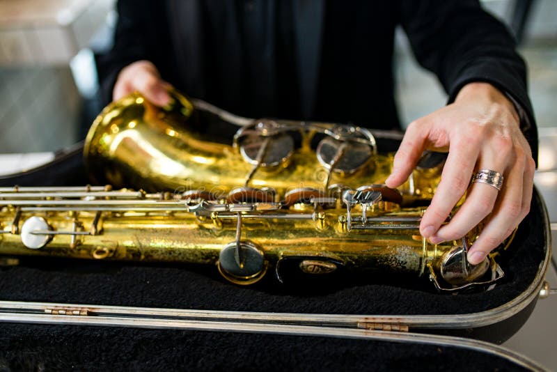 Student Learning To Play on Saxophone in the Room Stock Image - Image ...