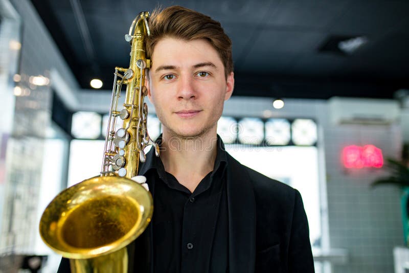 Student Learning To Play on Saxophone in the Room Stock Image - Image ...