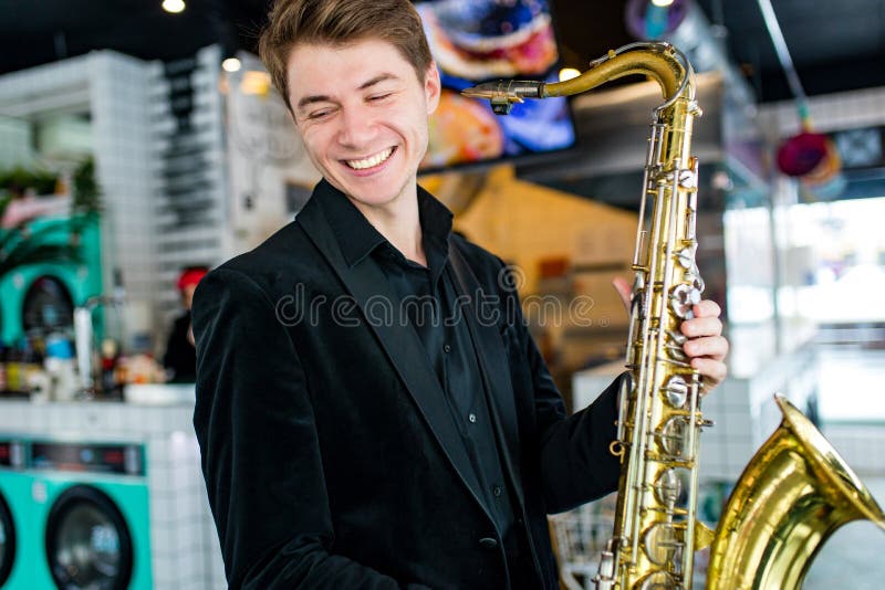 Student Learning To Play on Saxophone in the Room Stock Photo - Image ...