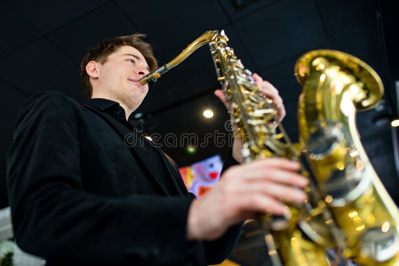 Student Learning To Play on Saxophone in the Room Stock Photo - Image ...