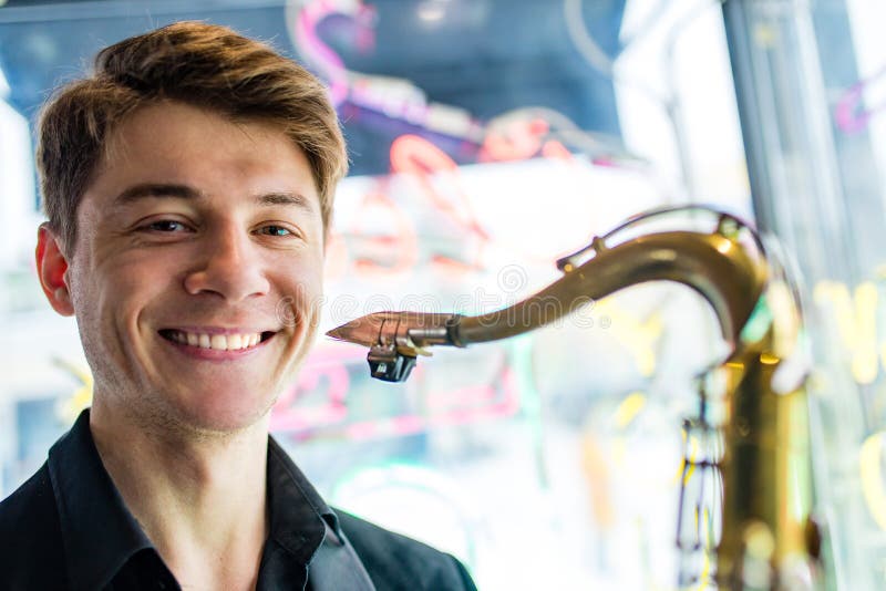 Student Learning To Play on Saxophone in the Room Stock Photo - Image ...