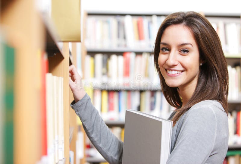Student in a library stock photo. Image of book, library - 24008170