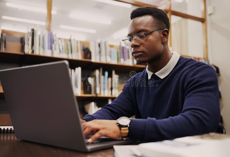 Student, Library and Black Man Typing on a Laptop in University or ...