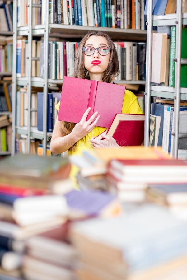 Student at the library stock image. Image of shelves - 88700925