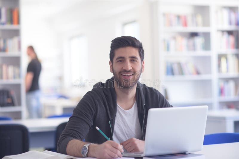 Student in a Library Working on a Tablet Stock Image - Image of middle ...