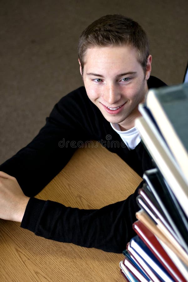 Student Looking at Book Stack Stock Photo - Image of overloaded ...
