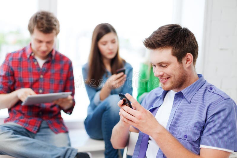 Student Looking into Smartphone at School Stock Image - Image of phone ...