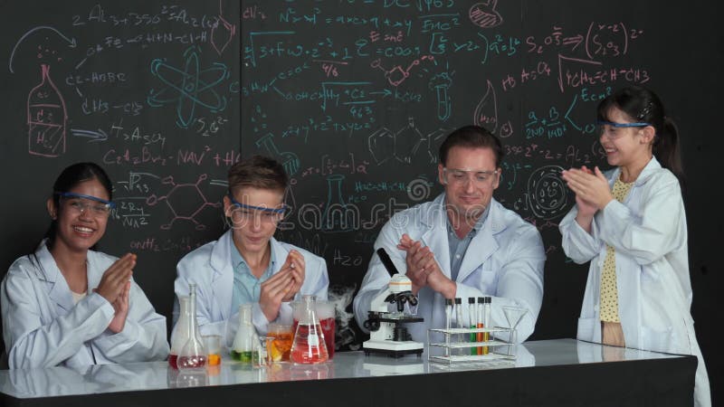 Student Looking Under Microscope while Cute Girl Inspect Sample ...