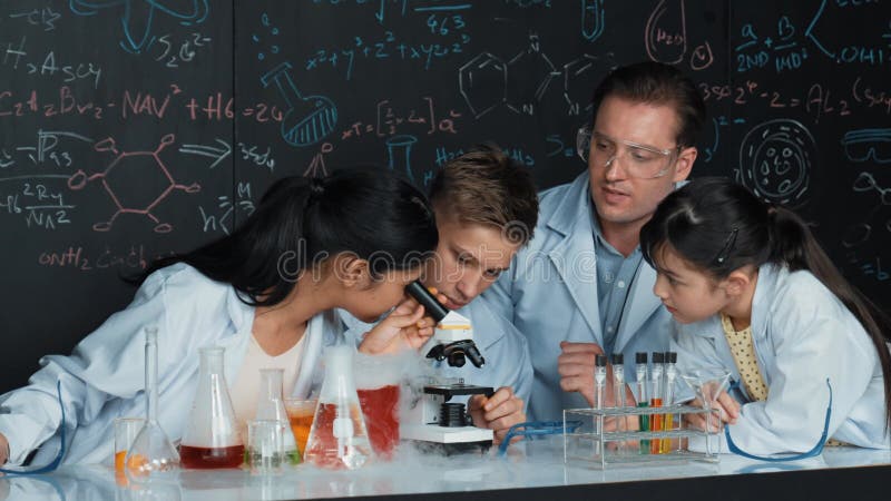 Young Student Doing Experiment by Pouring Sample in Test Tube ...