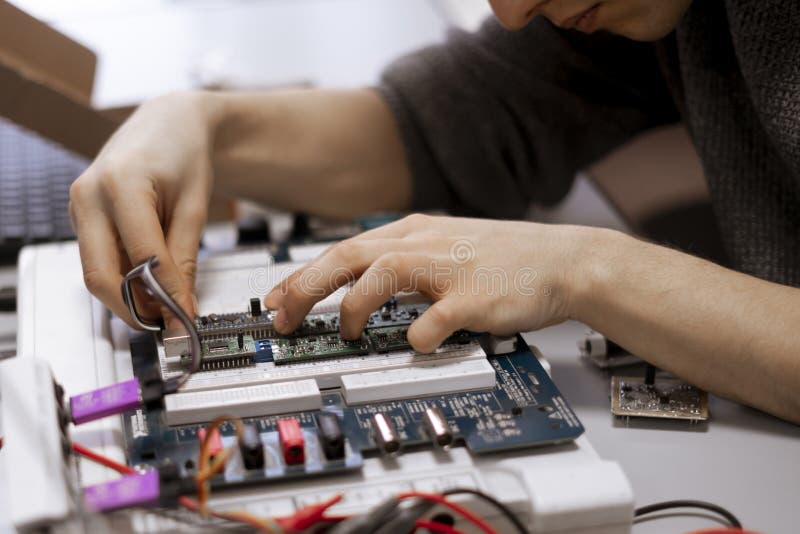 A Student Making Measurement and Costruct the Circuit Board with ...