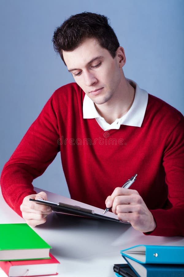 A student making notes stock image. Image of concentrated - 40957313