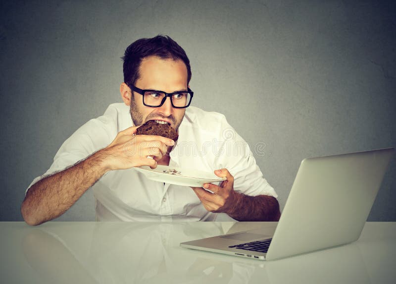 Student Man Eating while Working on Laptop Stock Photo - Image of male ...