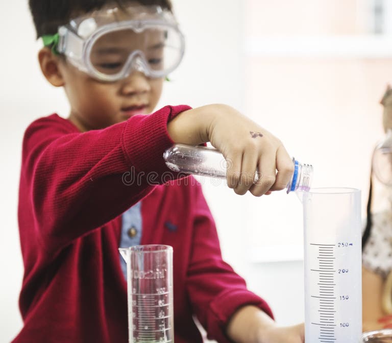 Student Mixing Solution in Science Experiment Class Stock Photo - Image ...