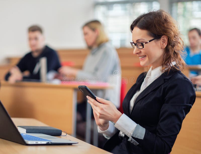 Student with a Mobile Phone in an Auditorium Stock Image - Image of ...