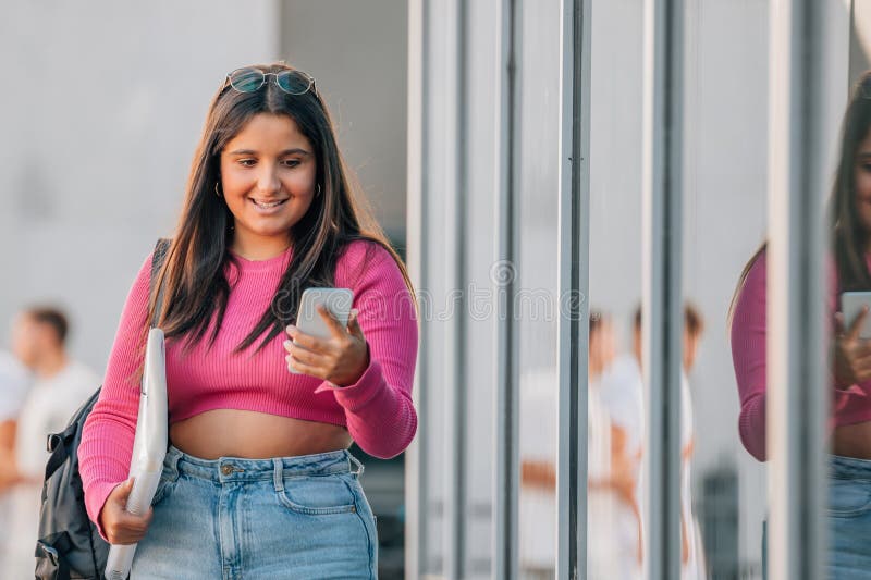 Student with mobile phone stock image. Image of university - 348430747