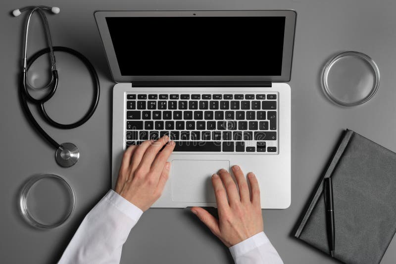 Student with Modern Laptop and Medical Stuff at Table Stock Image ...