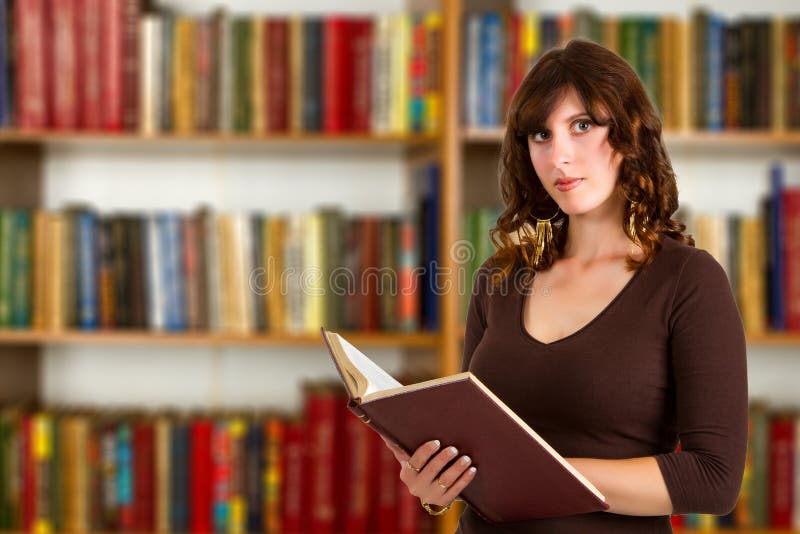 Student with open book stock photo. Image of bookshelf - 57415488