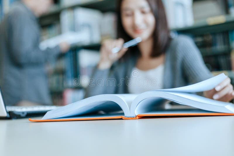 Student with Open Textbook Deep in Thought Stock Image - Image of ...