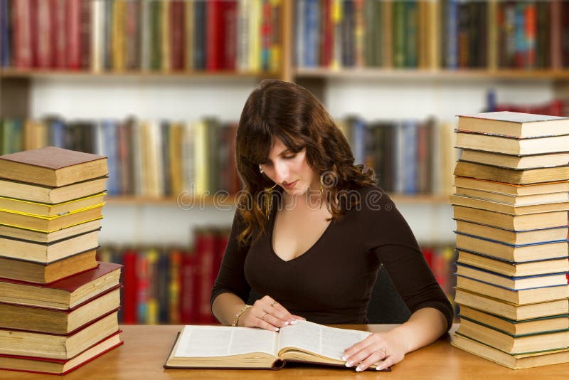 Student with Open Book Reading it in College Library Stock Image ...