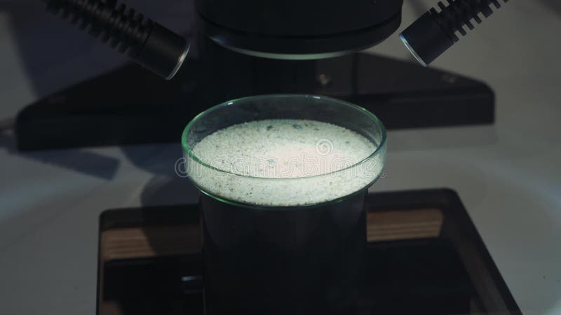 A Student Operates an Electron Microscope and Looks at Grains of Quartz ...