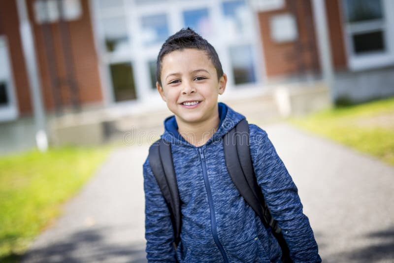 Student Outside School Standing Smiling Stock Photo - Image of ...