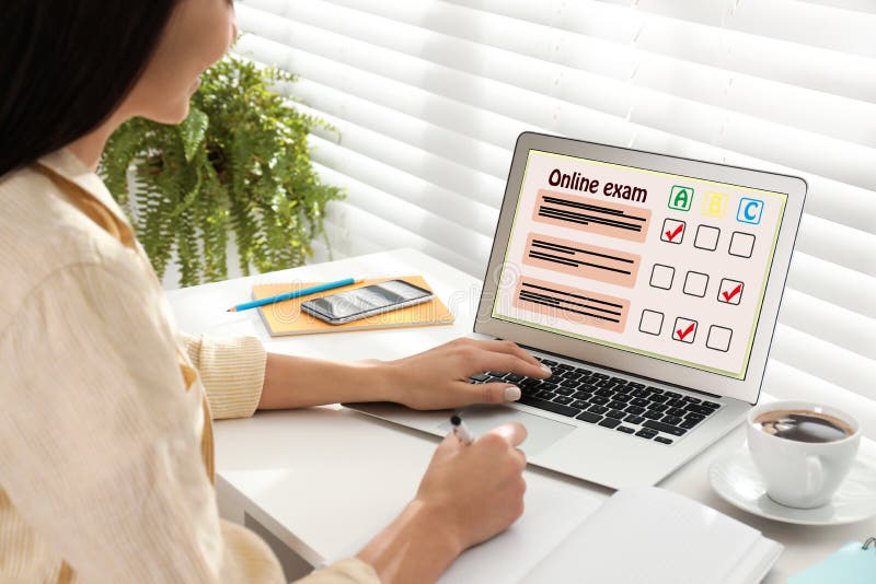 Student Passing Online Exam at Wooden Table Stock Image - Image of ...