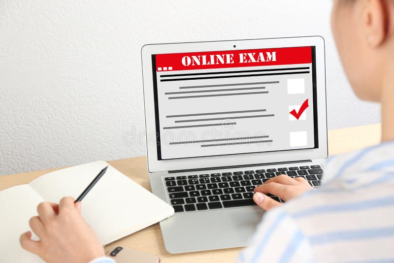 Student Passing Online Exam at Wooden Table Stock Image - Image of ...