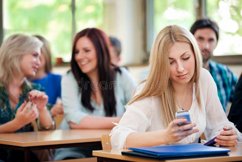 Group of Students Using Smart Mobile Phones in Classroom Stock Photo ...