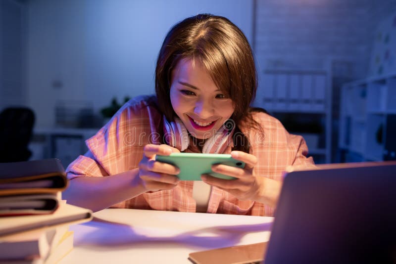 Student play game on phone stock photo. Image of media - 150247448