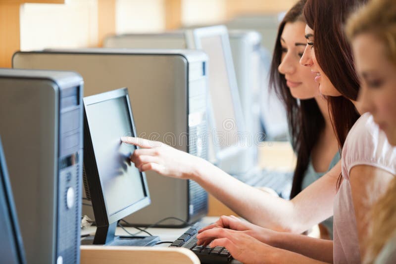 Student Pointing at Something To Her Friend Stock Photo - Image of ...