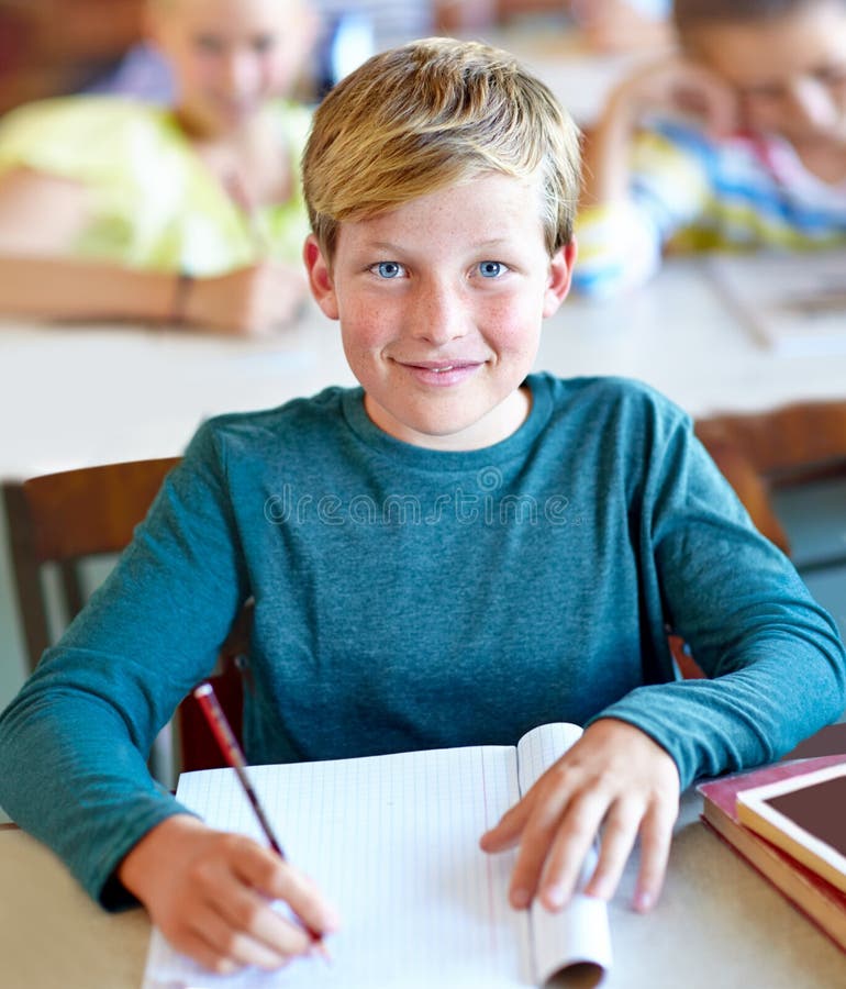 Student, Portrait and Boy Writing Notes for Learning in Classroom, Book ...