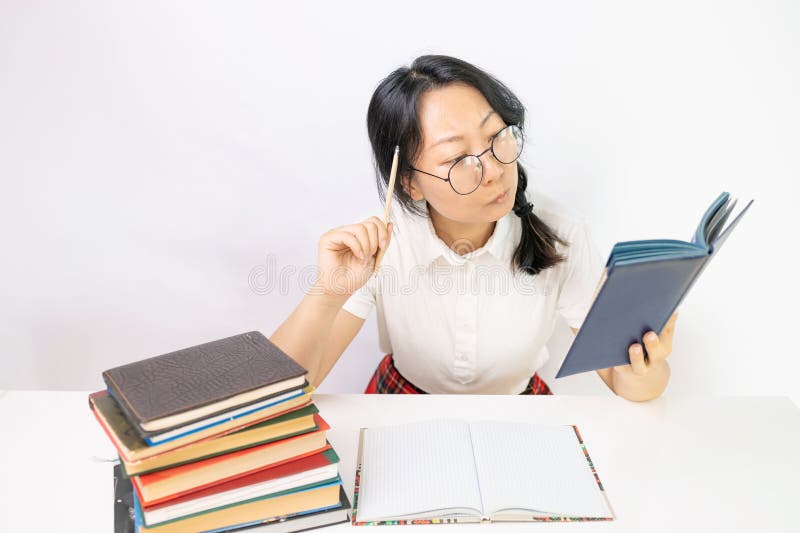 Student Preparing for College Test, Exam, Reading Book, Studying ...