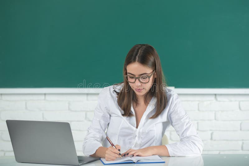 Student Preparing Exam and Learning Lessons in School Classroom. Female ...