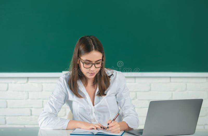 Student Preparing Exam and Learning Lessons in School Classroom. Female ...