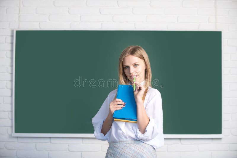 Student Preparing Exam and Learning Lessons in School Classroom. Female ...