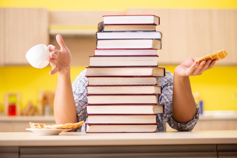 The Student Preparing for Exam Sitting at the Kitchen Stock Photo ...