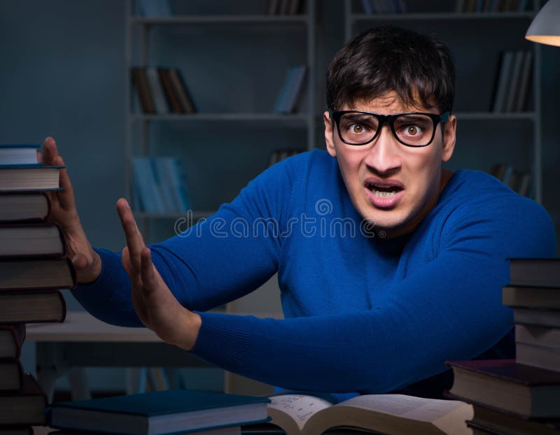 Student Preparing for Exams Late at Night in Library Stock Image ...