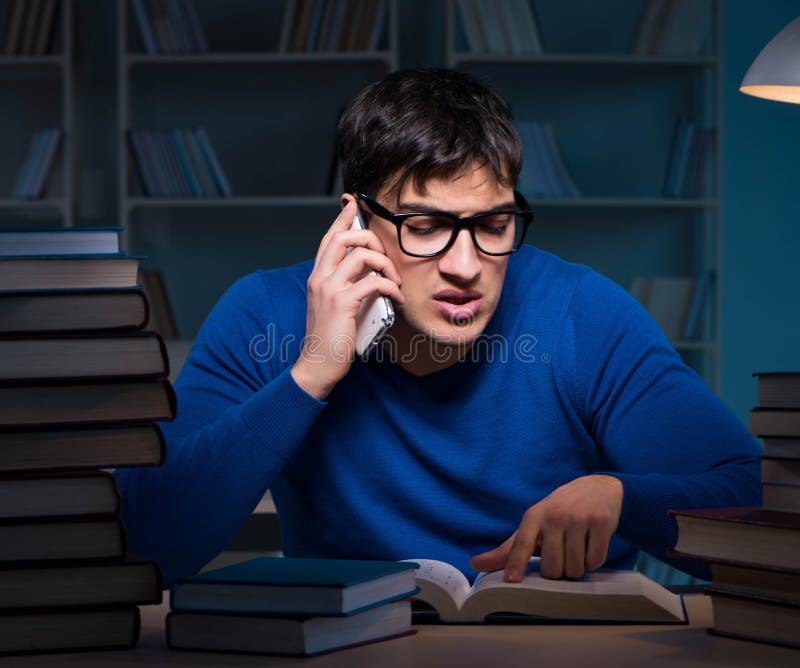 Student Preparing for Exams Late at Night in Library Stock Image ...
