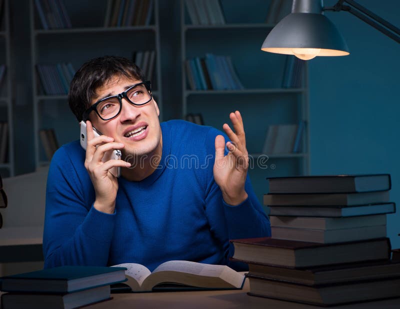 Student Preparing for Exams Late at Night in Library Stock Image ...