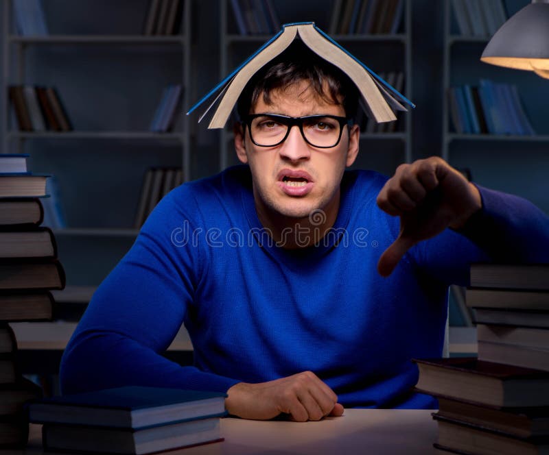 Student Preparing for Exams Late at Night in Library Stock Image ...