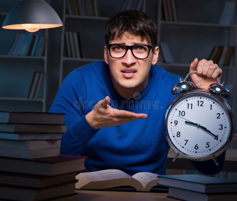Student Preparing for Exams Late at Night in Library Stock Photo ...