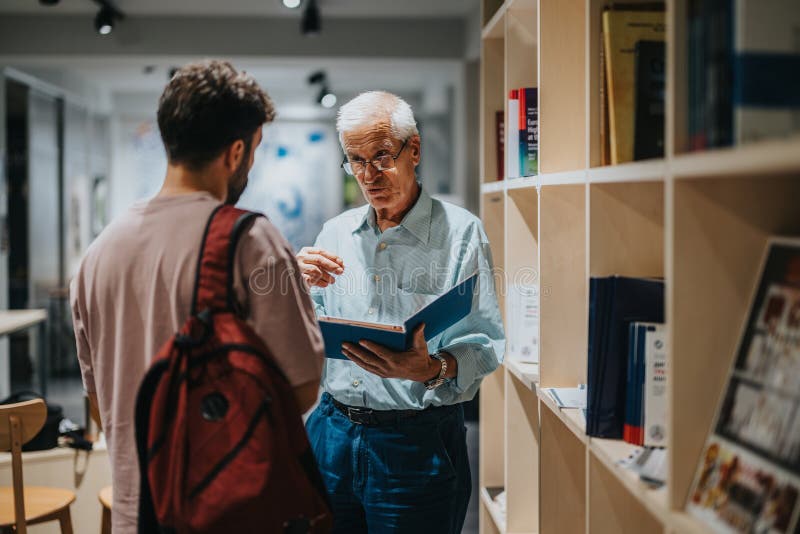 Student Professor Discussing Library Setting Stock Photos - Free ...