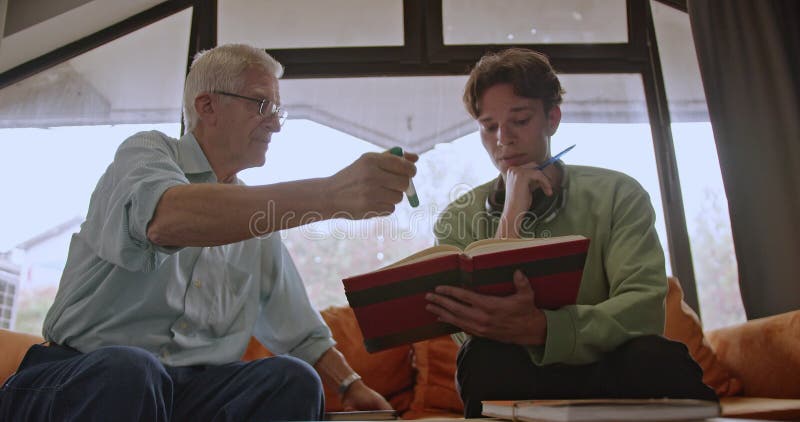 A Student and Professor are Working Together. the Professor is Helping ...