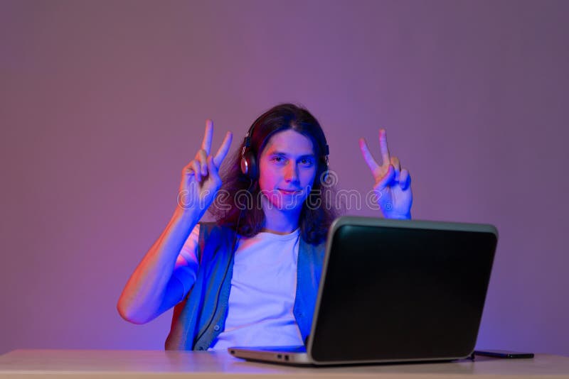 Student or Programmer at a Laptop, Portrait in Neon Tinting. Funny Guy ...