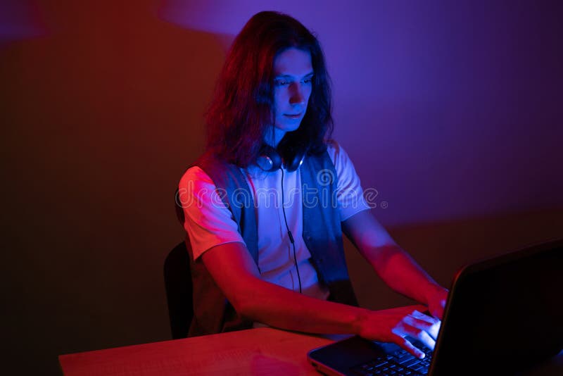 Student or Programmer at a Laptop, Portrait in Neon Tinting. Funny Guy ...