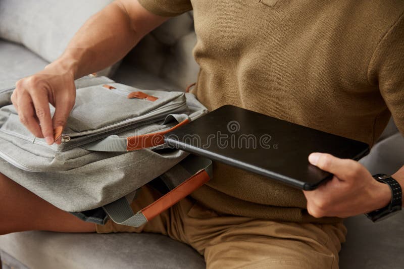 Student Putting Tablet in Backpack Stock Photo - Image of device ...