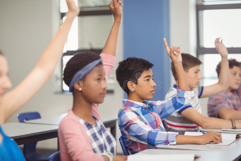 Student Raising Hand in Classroom Stock Photo - Image of education ...