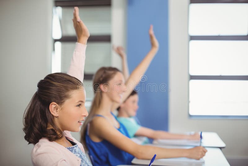 Student Raising Hand in Classroom Stock Image - Image of pencil ...
