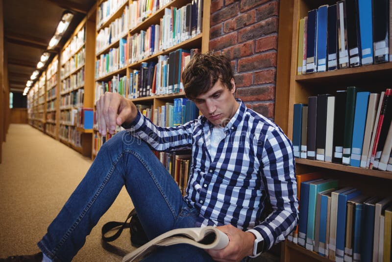 Student Reading Book in College Library Stock Photo - Image of research ...