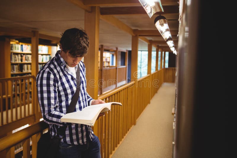 Student Reading Book in College Library Stock Image - Image of bookcase ...